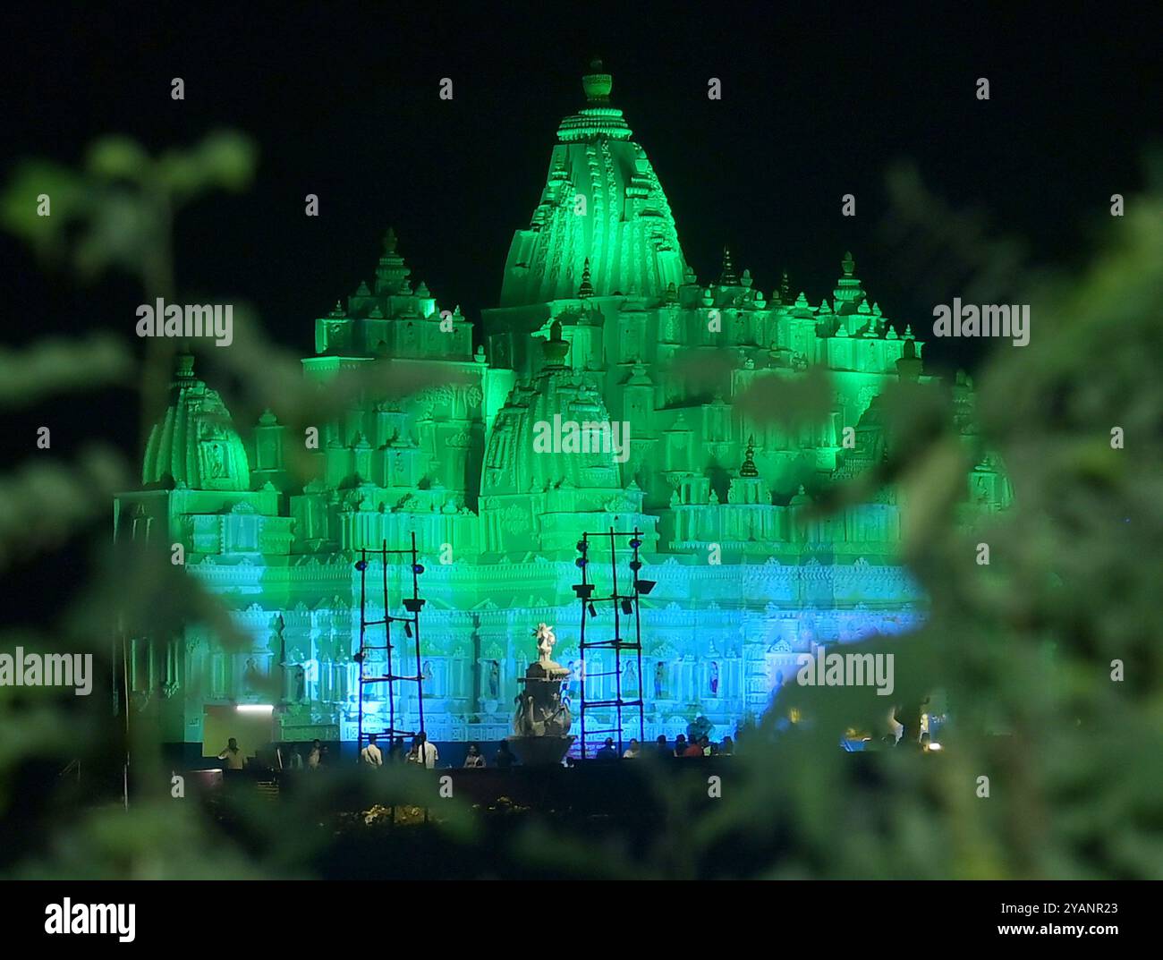 An illuminated "pandal", or temporary platform is seen where the idols ...