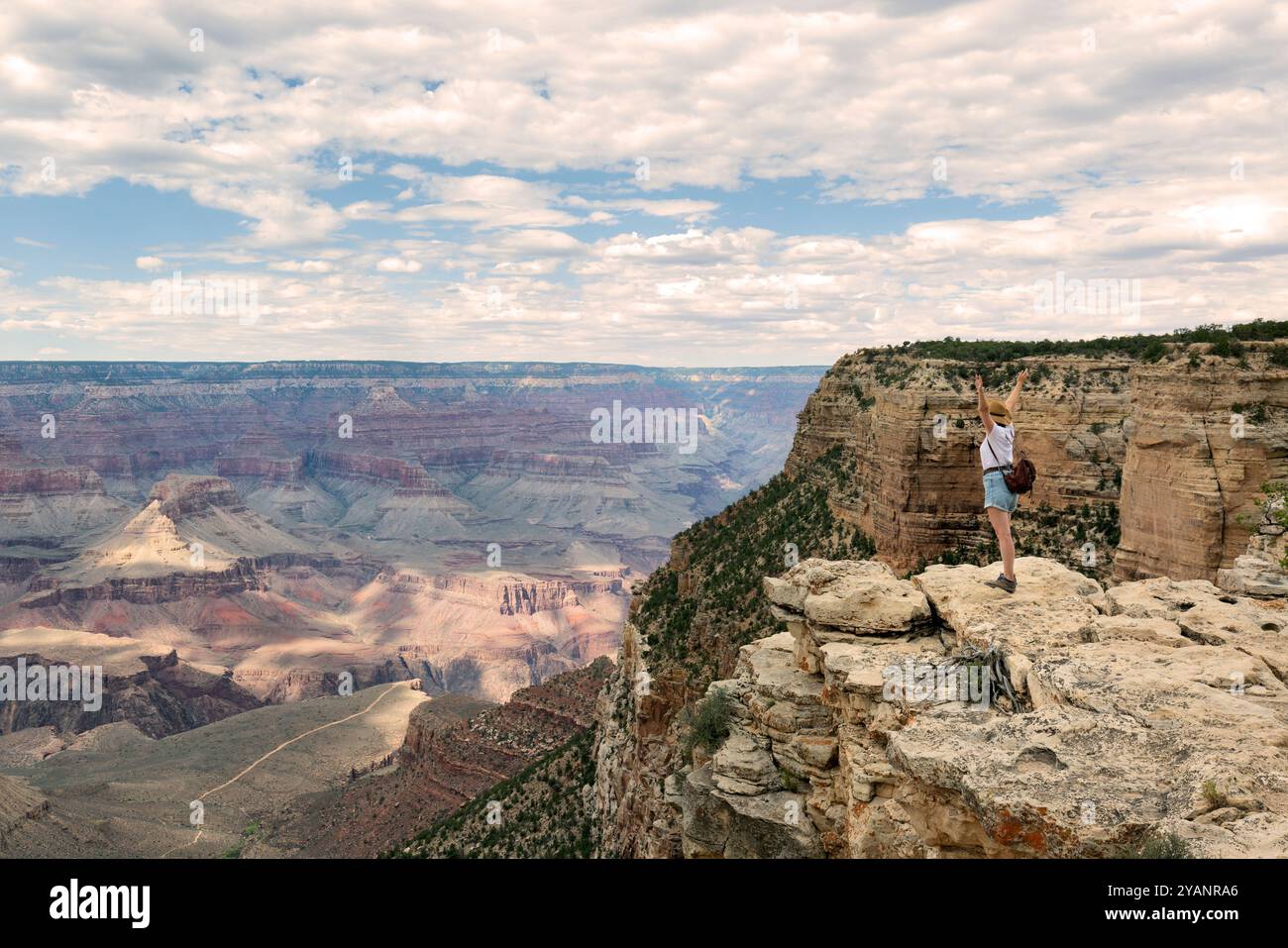 Hiker with arms up standing on the top of the mountain - Successful man ...