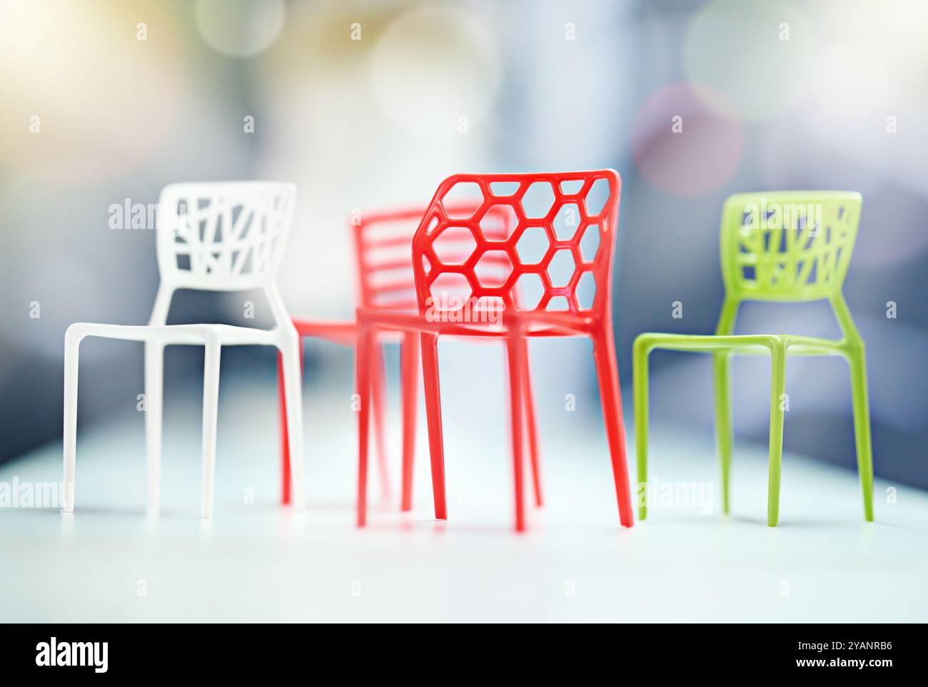 Furniture, design and miniature chair collection on counter with color ...