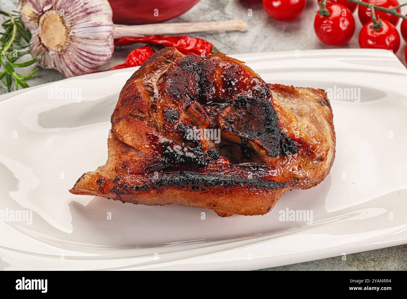 Roasted pork knuckle steak with bone Stock Photo - Alamy
