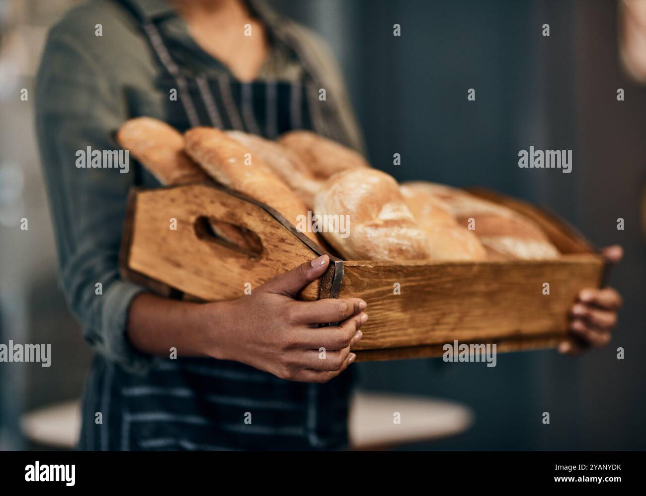 Bakery, basket and hands of person with bread in cafe for serving food ...