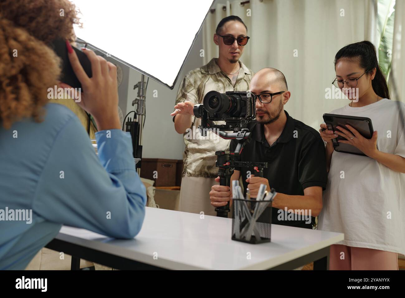Cameraman Shooting Model On Camera Stock Photo - Alamy