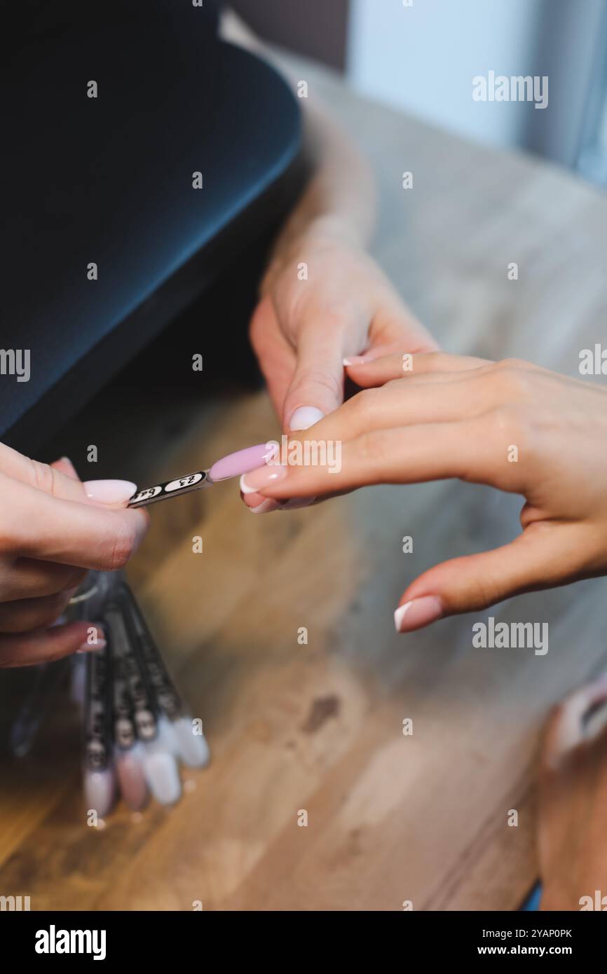 Girl painting her fingernails hi-res stock photography and images - Alamy