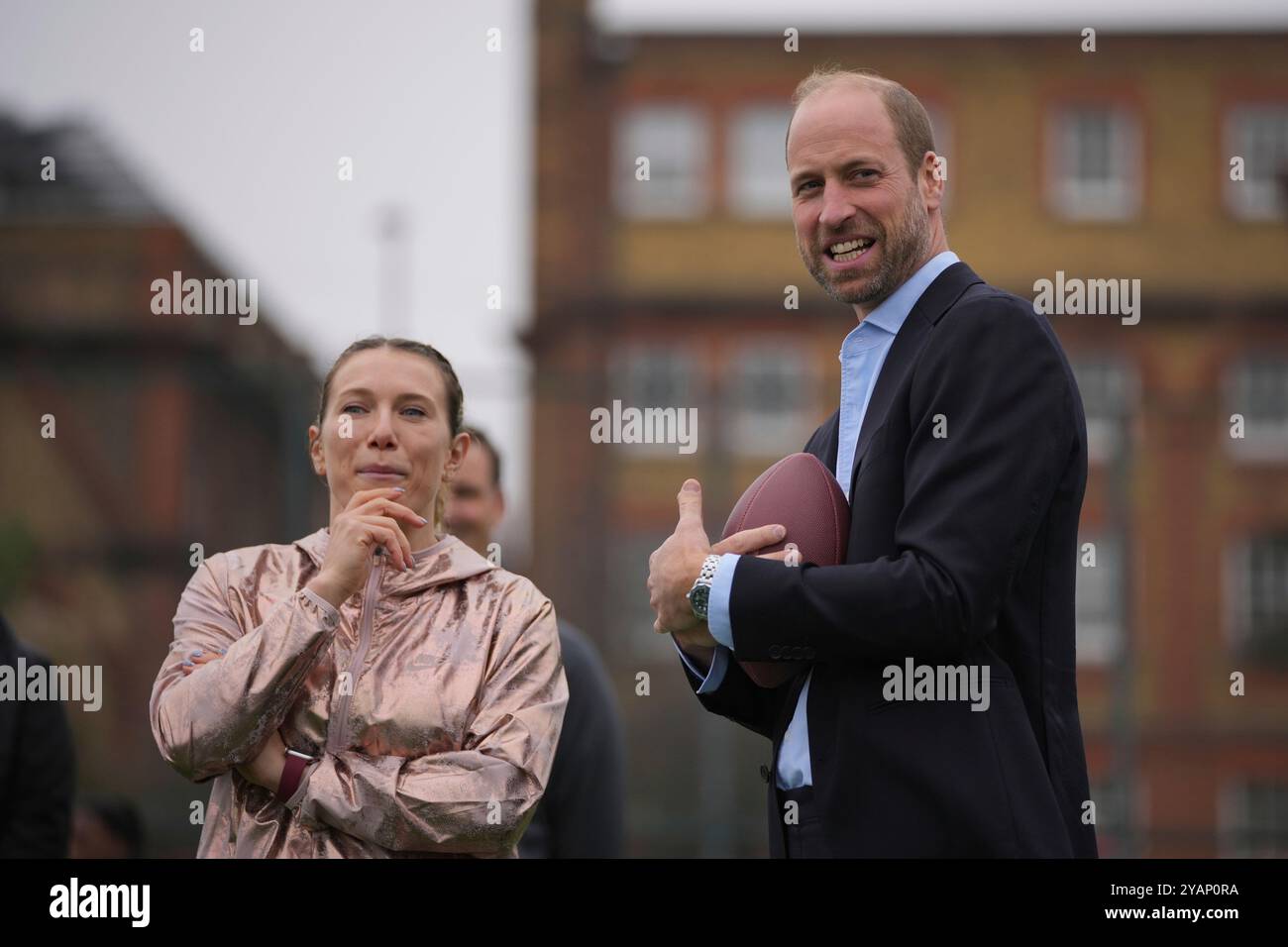 Britain's Prince William speaks to Phoebe Schecter as he attends a NFL ...