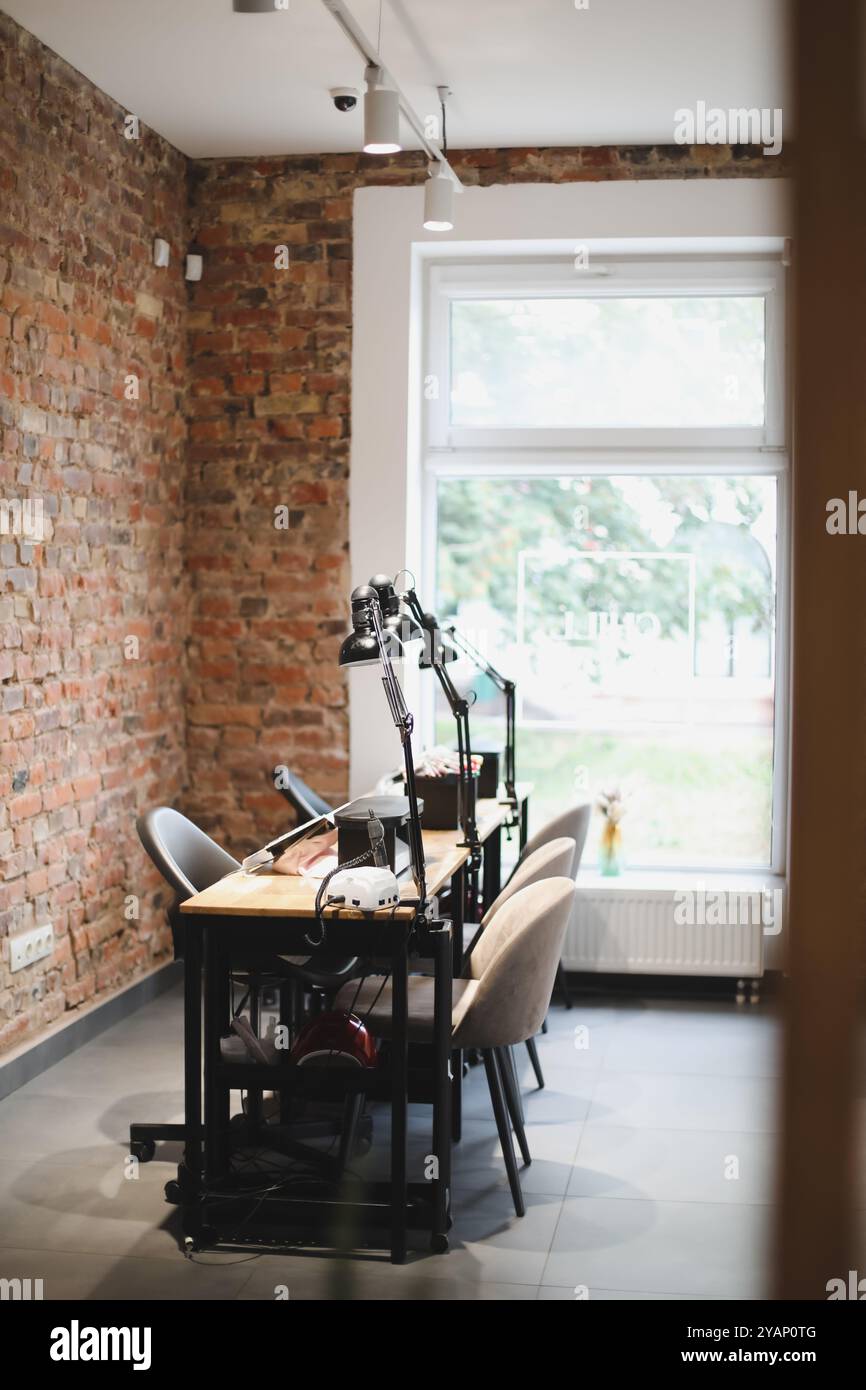 Nail salon loft interior. View of modern manicure shop. Inside beauty ...