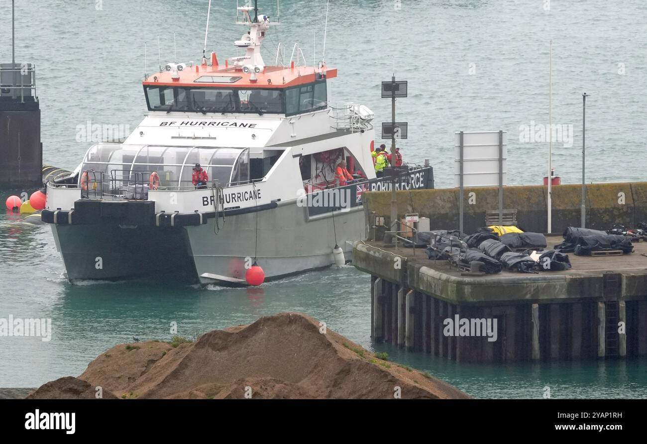 A group of people thought to be migrants are brought in to Dover, Kent, onboard a Border Force ...
