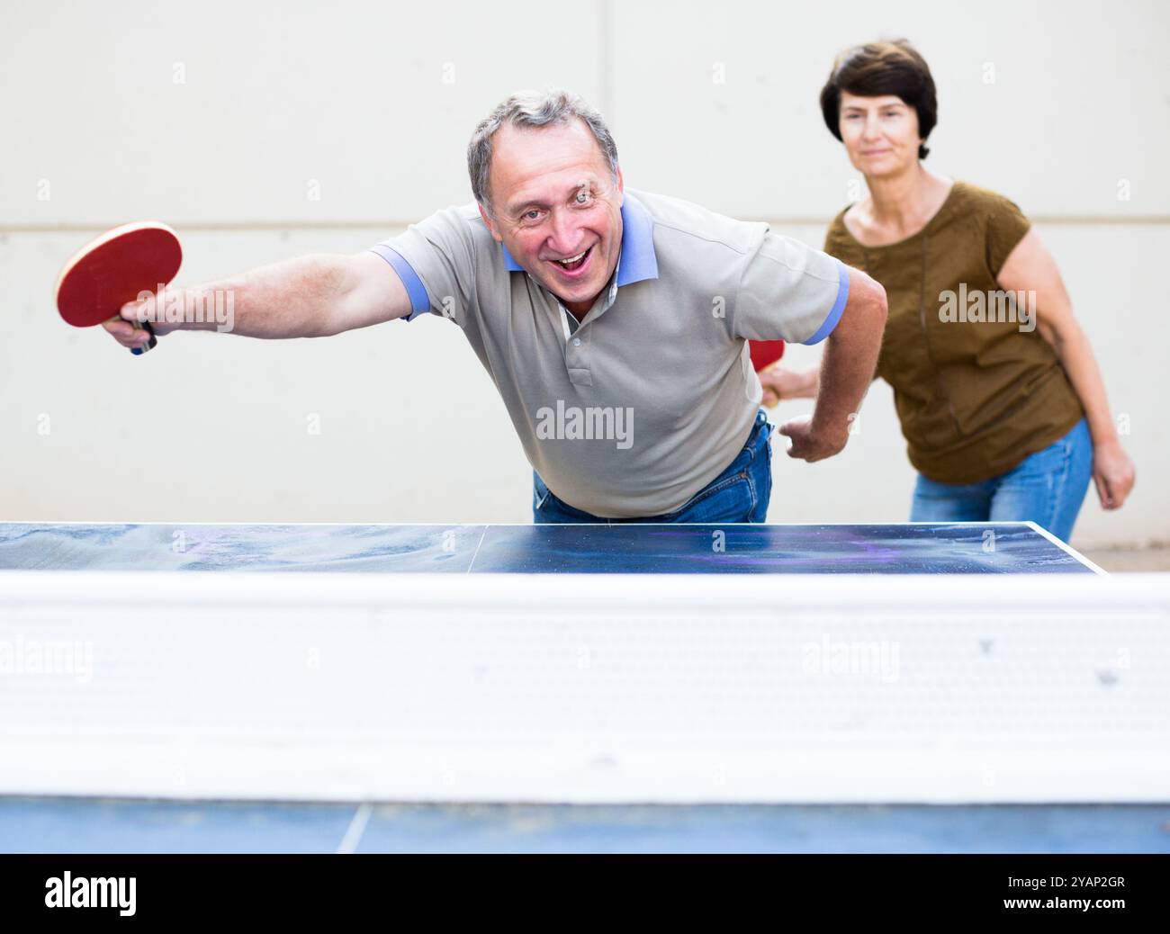 Beautiful mature woman playing tennis hi-res stock photography and ...