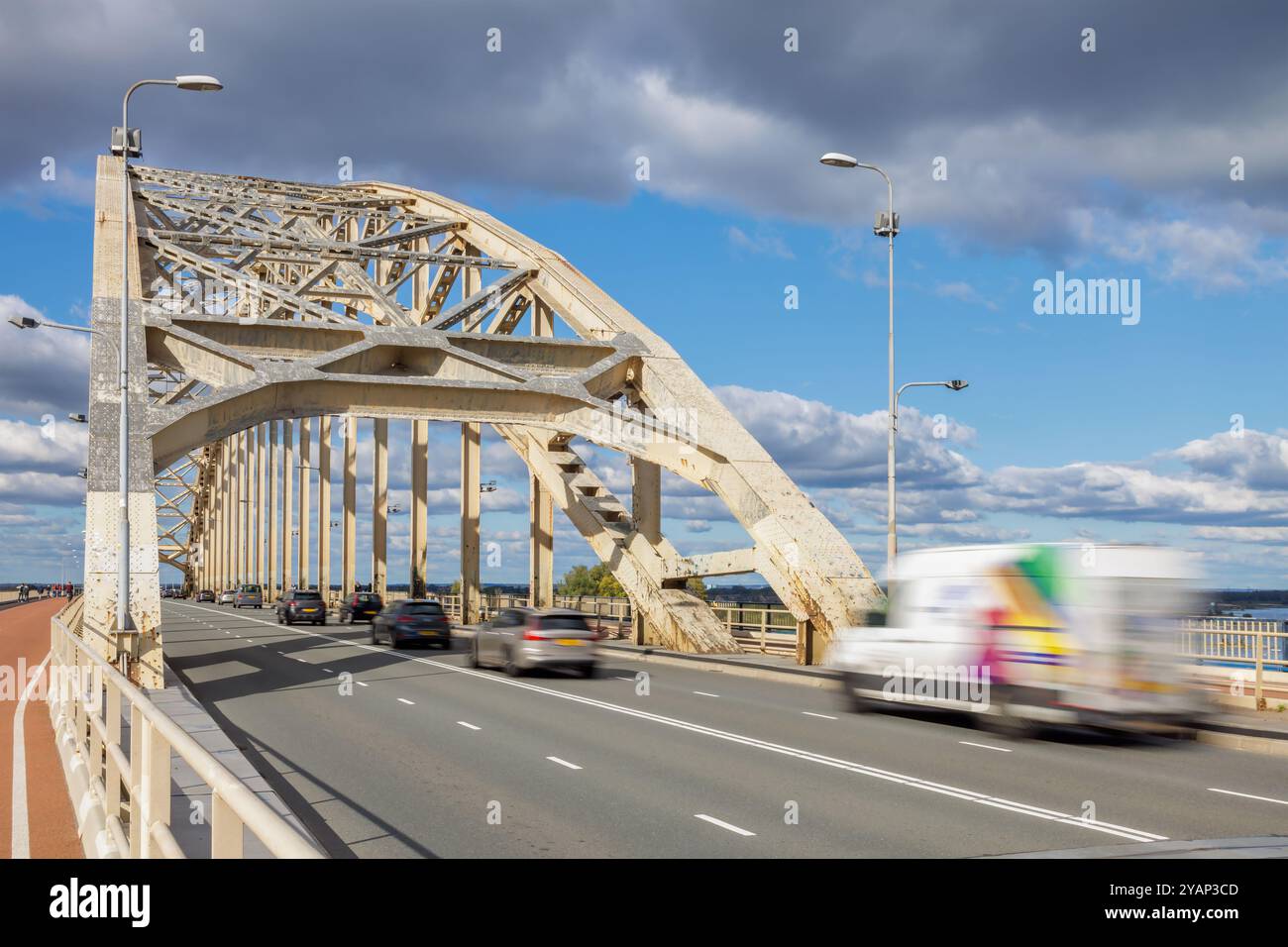 Traffic passing the Dutch Waalbrug bridge over the river Waal in ...