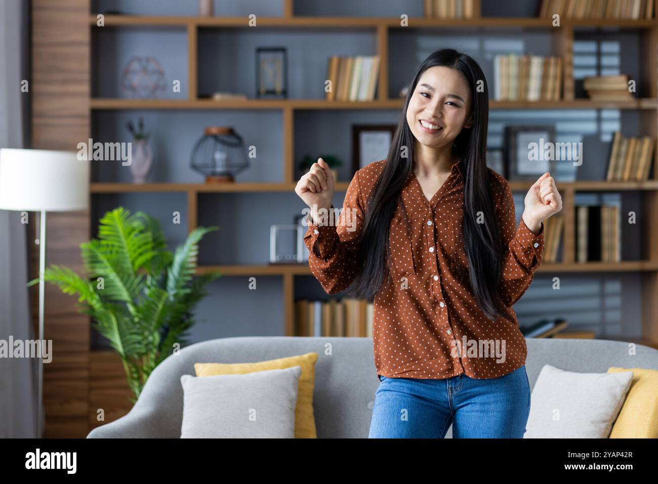 Happy cozy young asian hi-res stock photography and images - Alamy