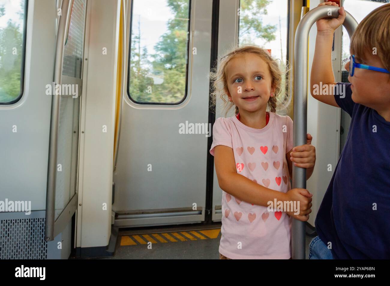 Kids enjoy a ride on train, exploring new adventures together Stock ...