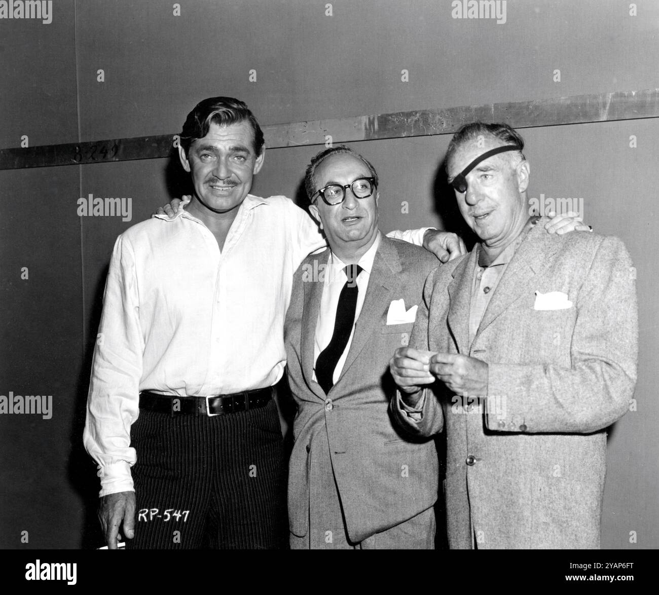 CLARK GABLE with Set Visitor Producer BOB GOLDSTEIN and Director RAOUL ...