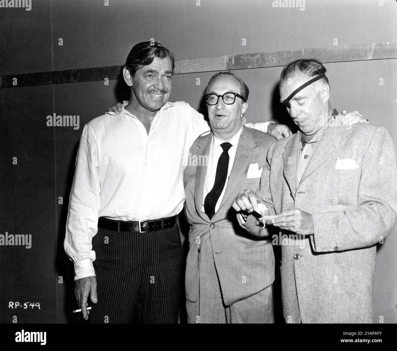 CLARK GABLE with Set Visitor Producer BOB GOLDSTEIN and Director RAOUL ...