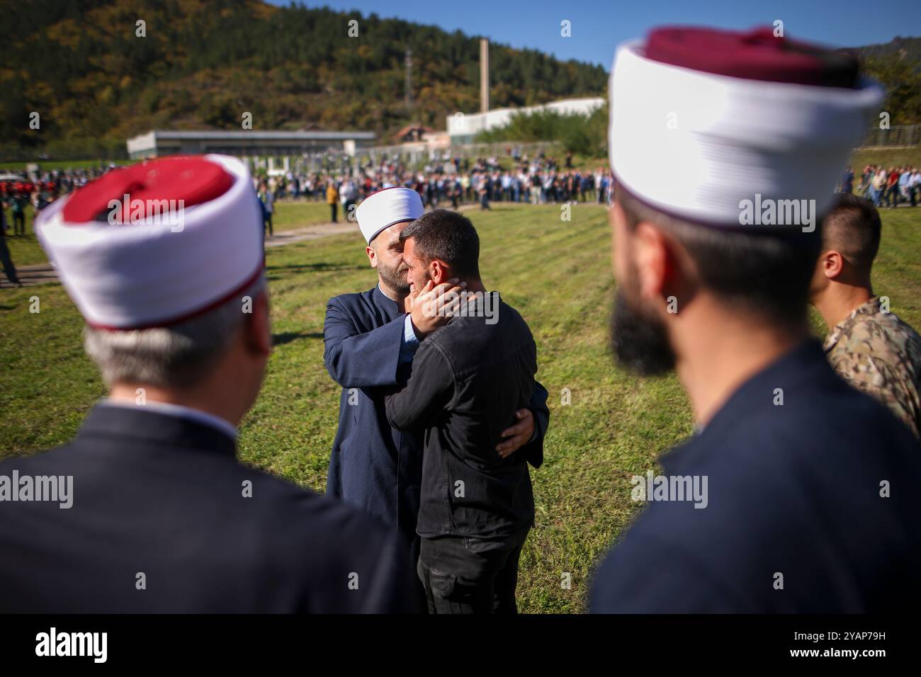 An imam comforts Dino Begic who lost his pregnant wife before the ...