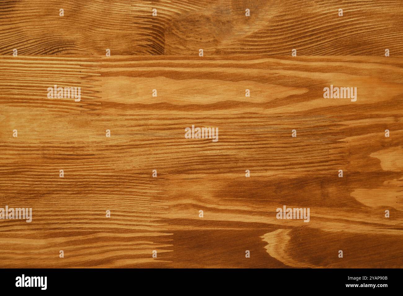 Applying walnut wood stain. Texture of wooden surface as background ...