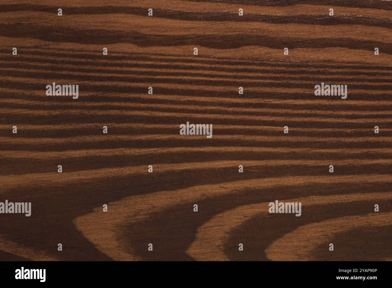 Texture of wooden surface after applying walnut wood stain as ...