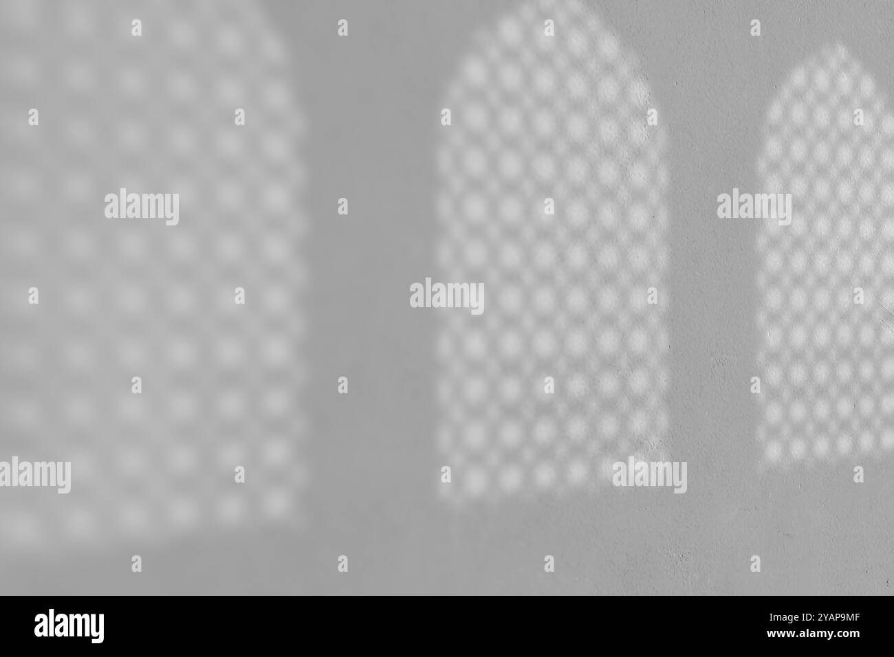White shadow of three arched mosque windows on the wall. Islamic ...