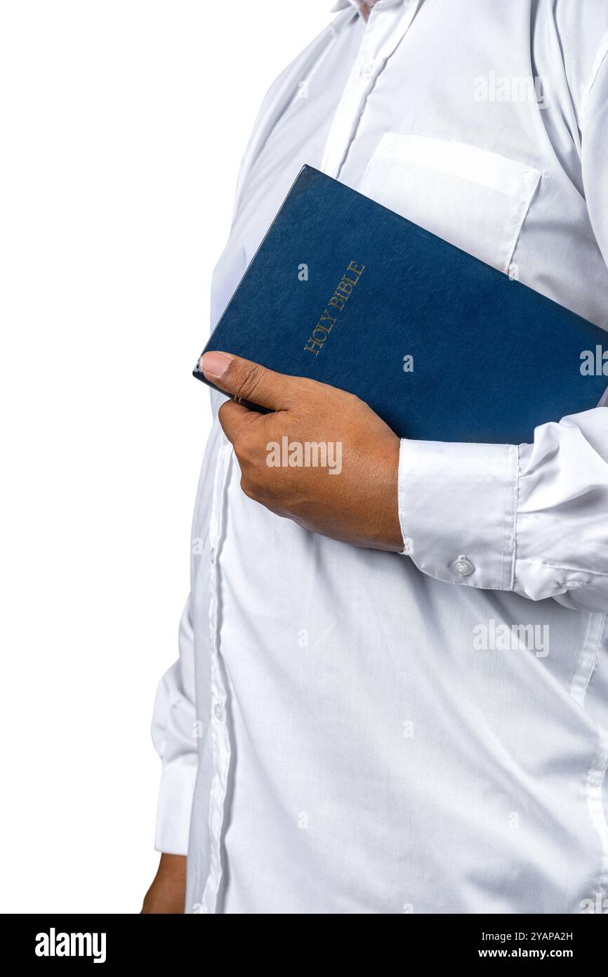 Christian man holding a holy bible in his hand. Symbol of faith in God ...