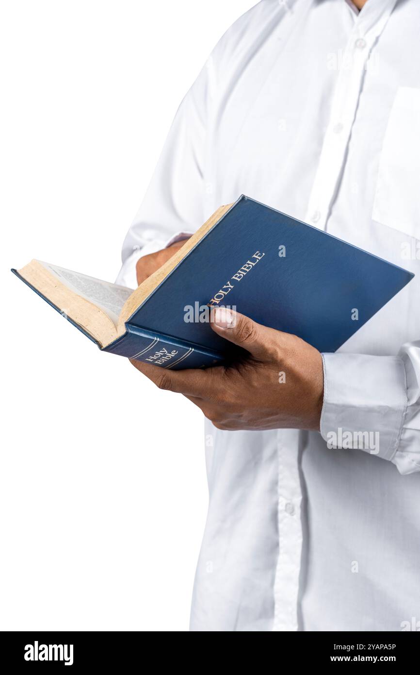Christian man holding and reading a holy bible in his hand. Symbol of ...