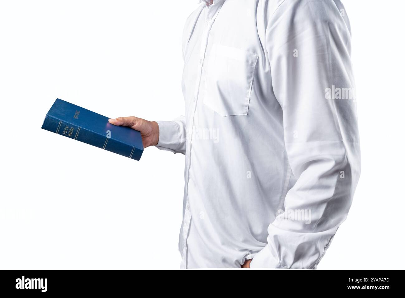 Christian man holding a holy bible in his hand. Symbol of faith in God ...