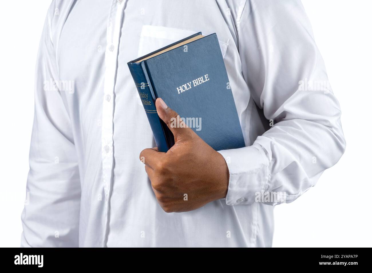 Christian man holding a holy bible in his hand. Symbol of faith in God ...