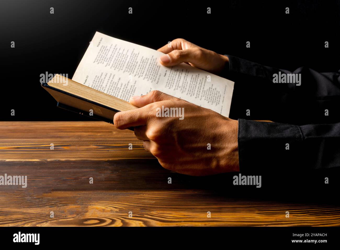 Man reading a holy bible in his hand. Symbol of faith and worship in ...