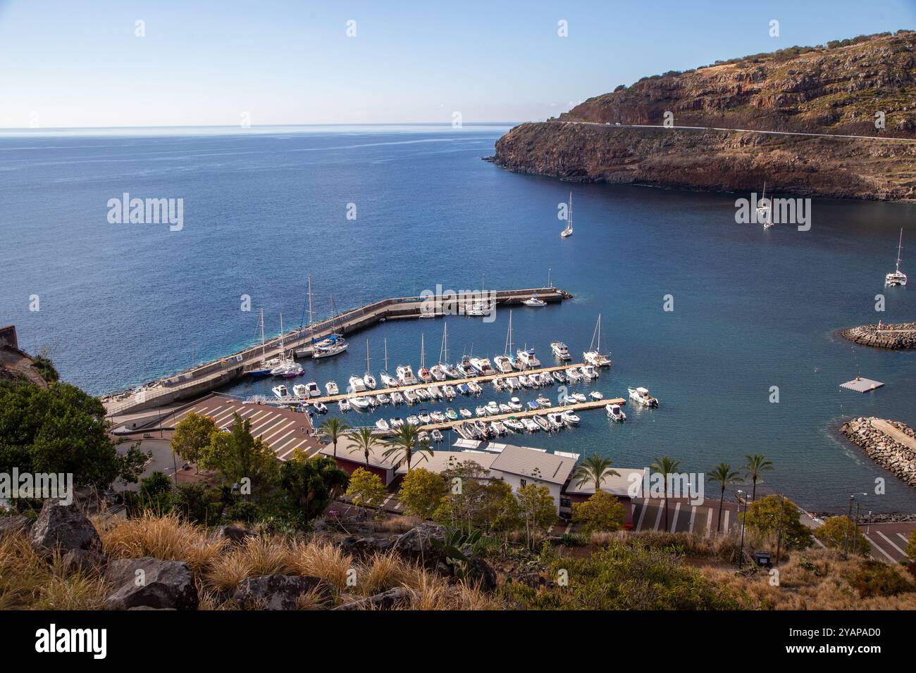 Yachts and boats in the harbour and marina at Machico, the second ...