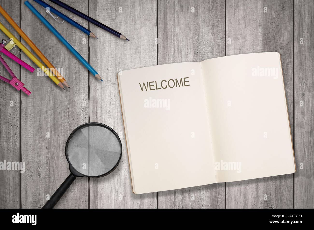 White book showing word "Welcome back" written on it. Welcome greeting ...