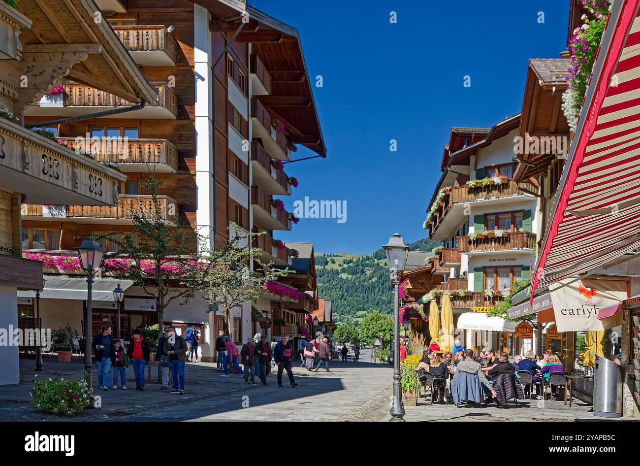 street scene, Gstaad Promenade, Swiss style buildings, shops, people ...