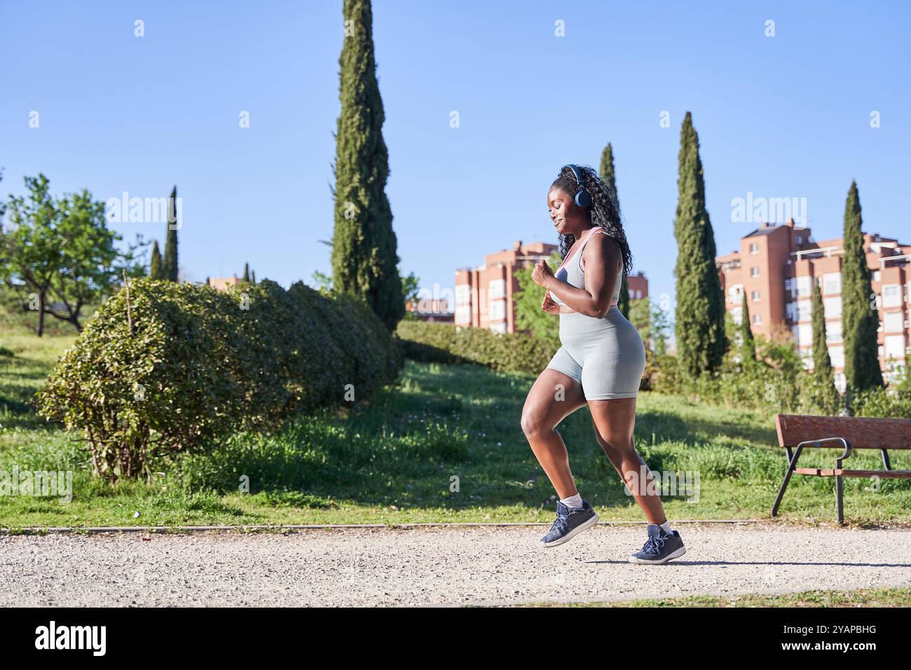 young woman running. woman doing her morning routine to get her day off ...