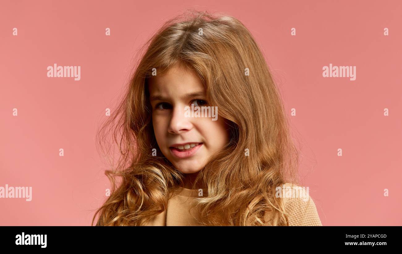 Girl's half-smile suggests playful hesitation, her eyes hinting at ...