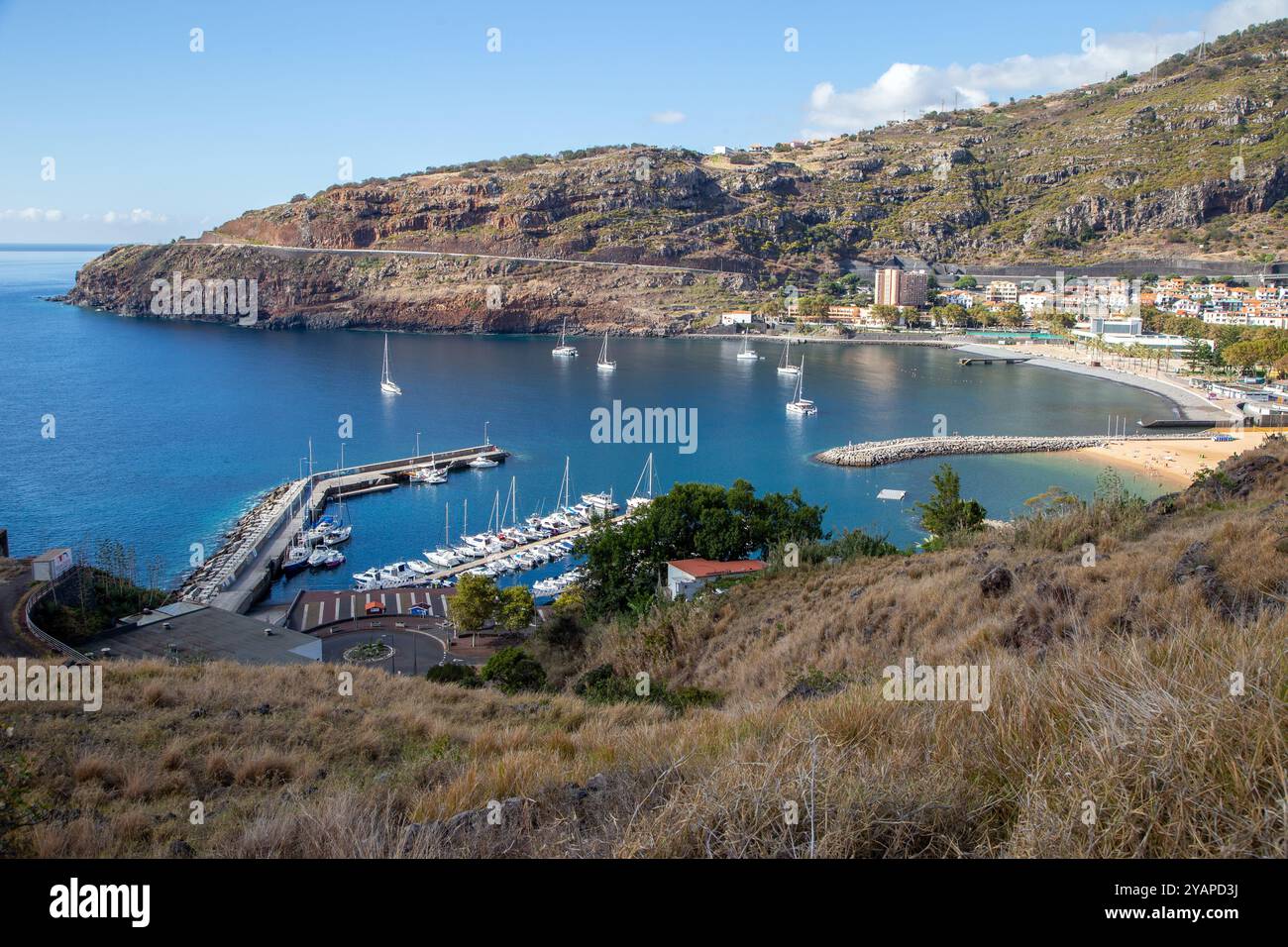 Yachts and boats in the harbour and marina at Machico, the second ...