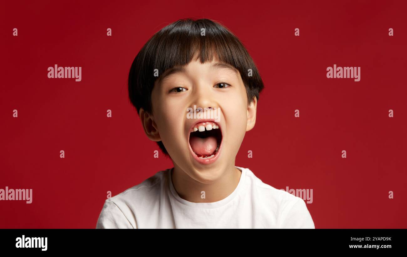 Little child with open mouth, playful energy shines through, against ...