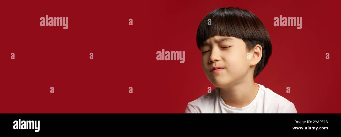 Banner. Child with eyes closed in exaggerated pain expression ...