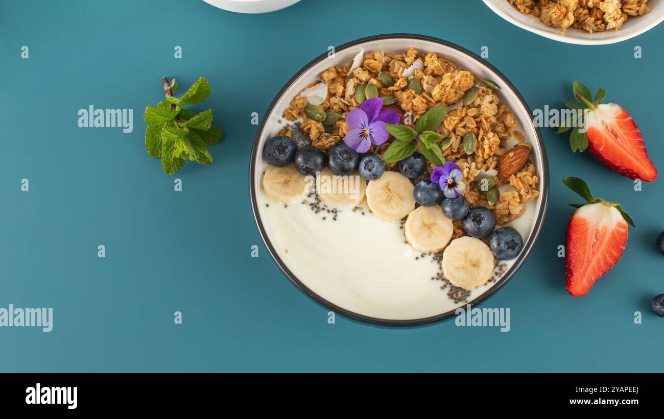 A healthy nutritious breakfast of natural Greek yoghurts, granola and ...