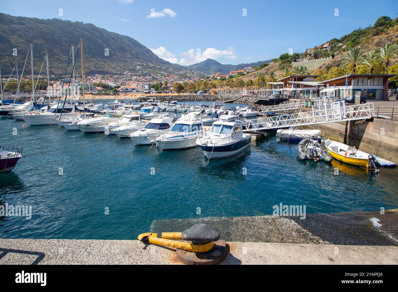 Boats and yachts in the harbour at Machico, the second largest resort ...