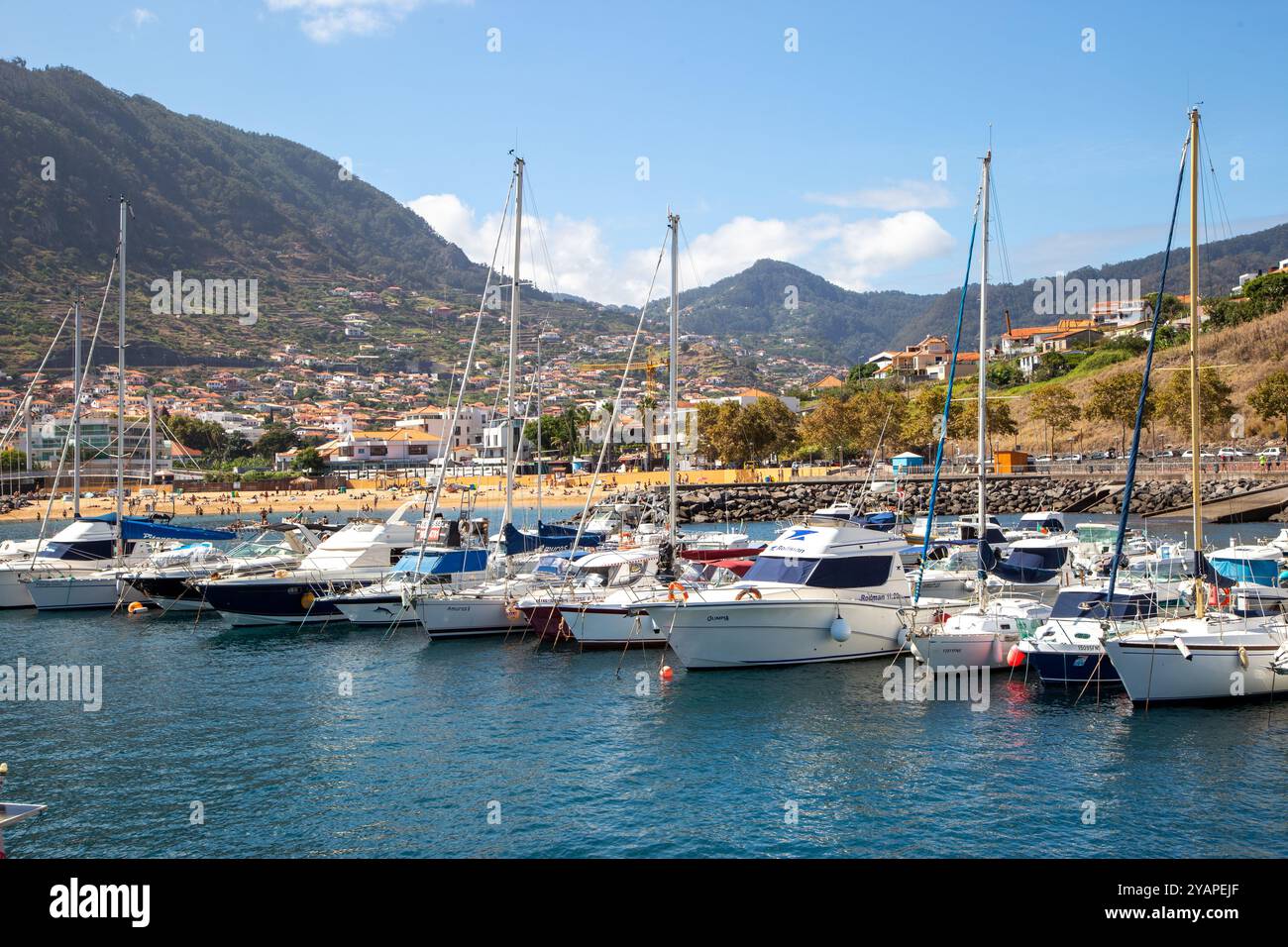 Boats and yachts in the harbour at Machico, the second largest resort ...