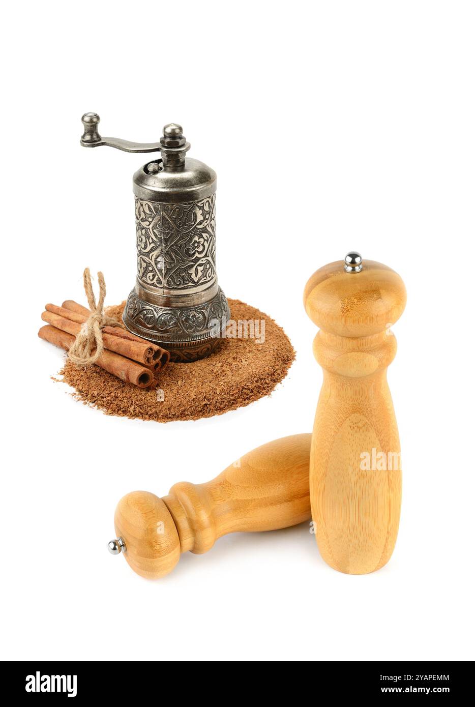 Hand grinder for spices, cinnamon sticks and powder isolated on white ...