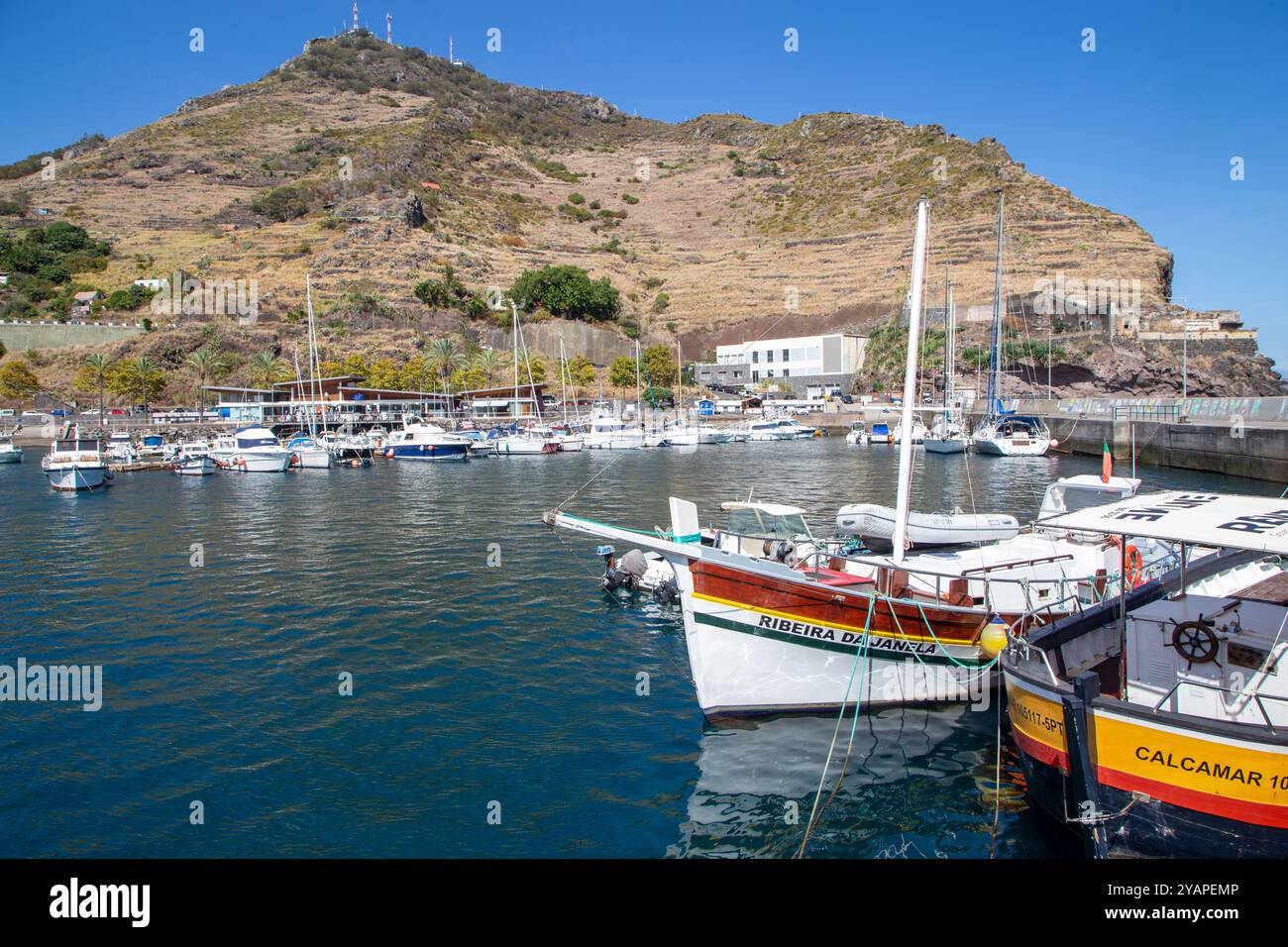 Boats and yachts in the harbour at Machico, the second largest resort ...