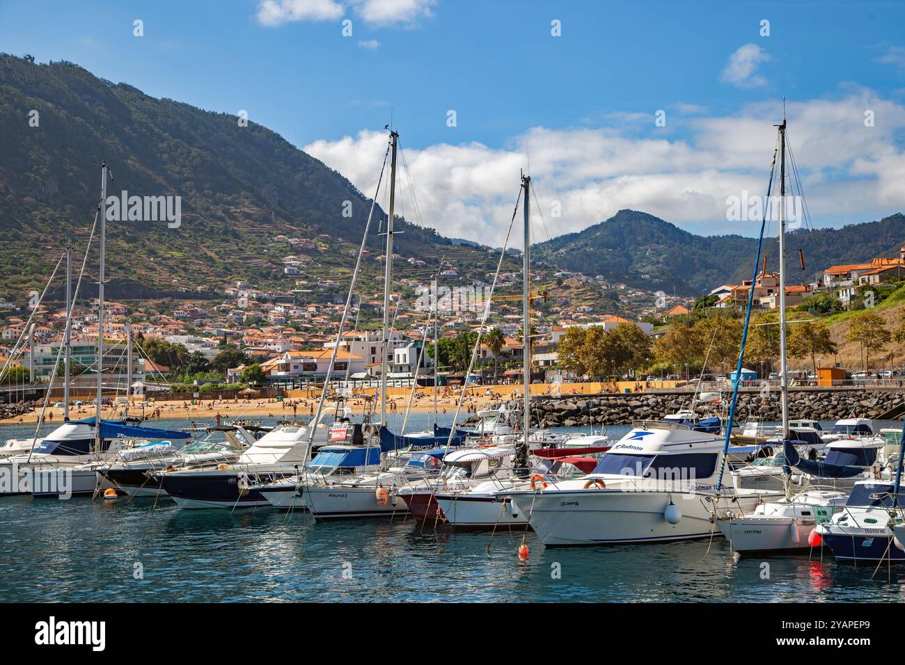 Boats and yachts in the harbour at Machico, the second largest resort ...