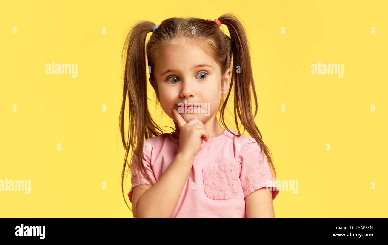 Girl thoughtfully touches her chin, deep in contemplation. Her wide ...