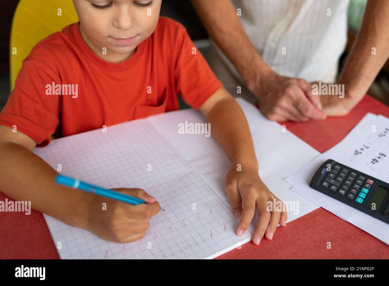 A six-year-old boy with dysgraphia and dyscalculia does his math ...