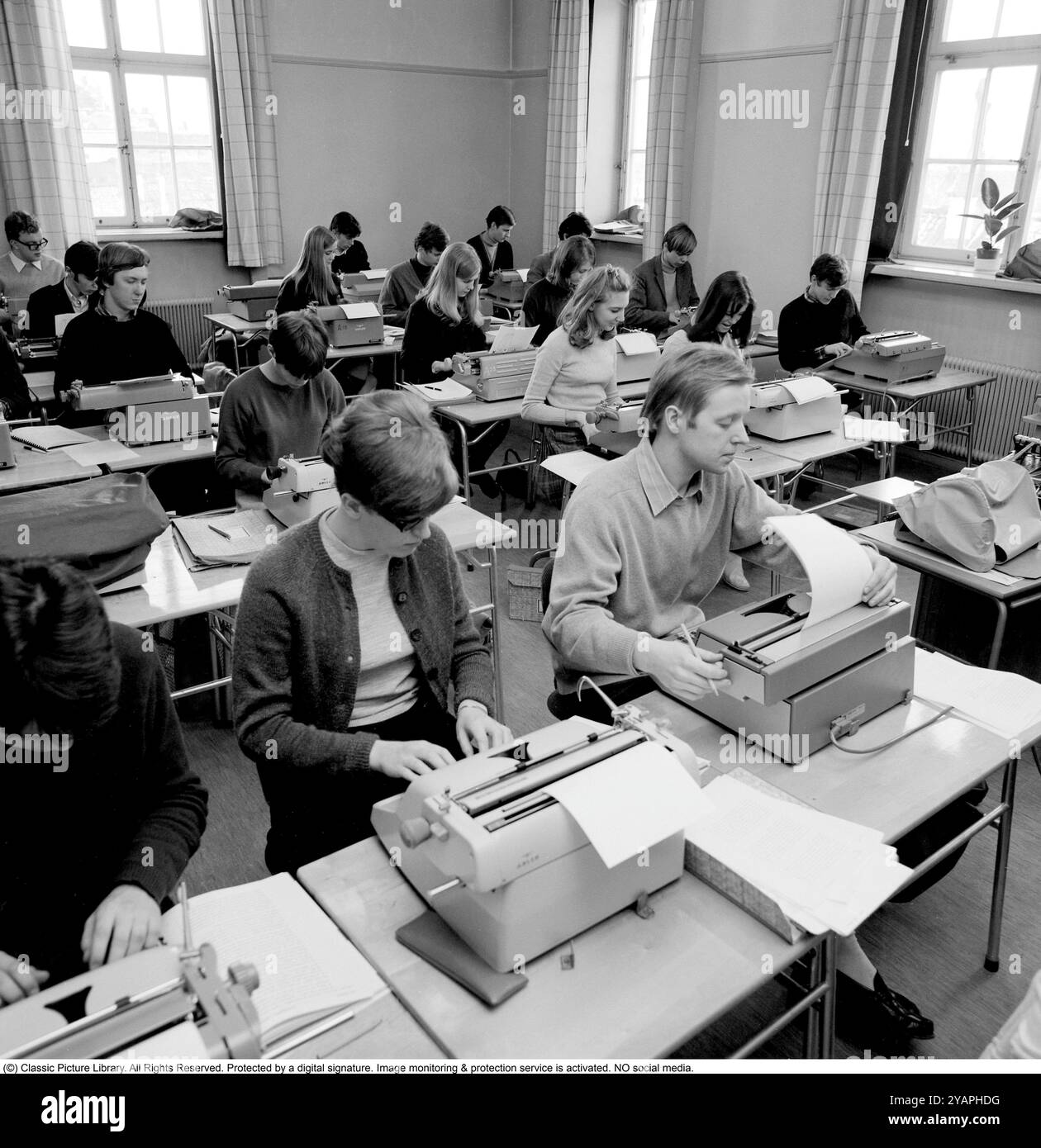 Learning to type in the 1960s. A classroom of students sitting at ...