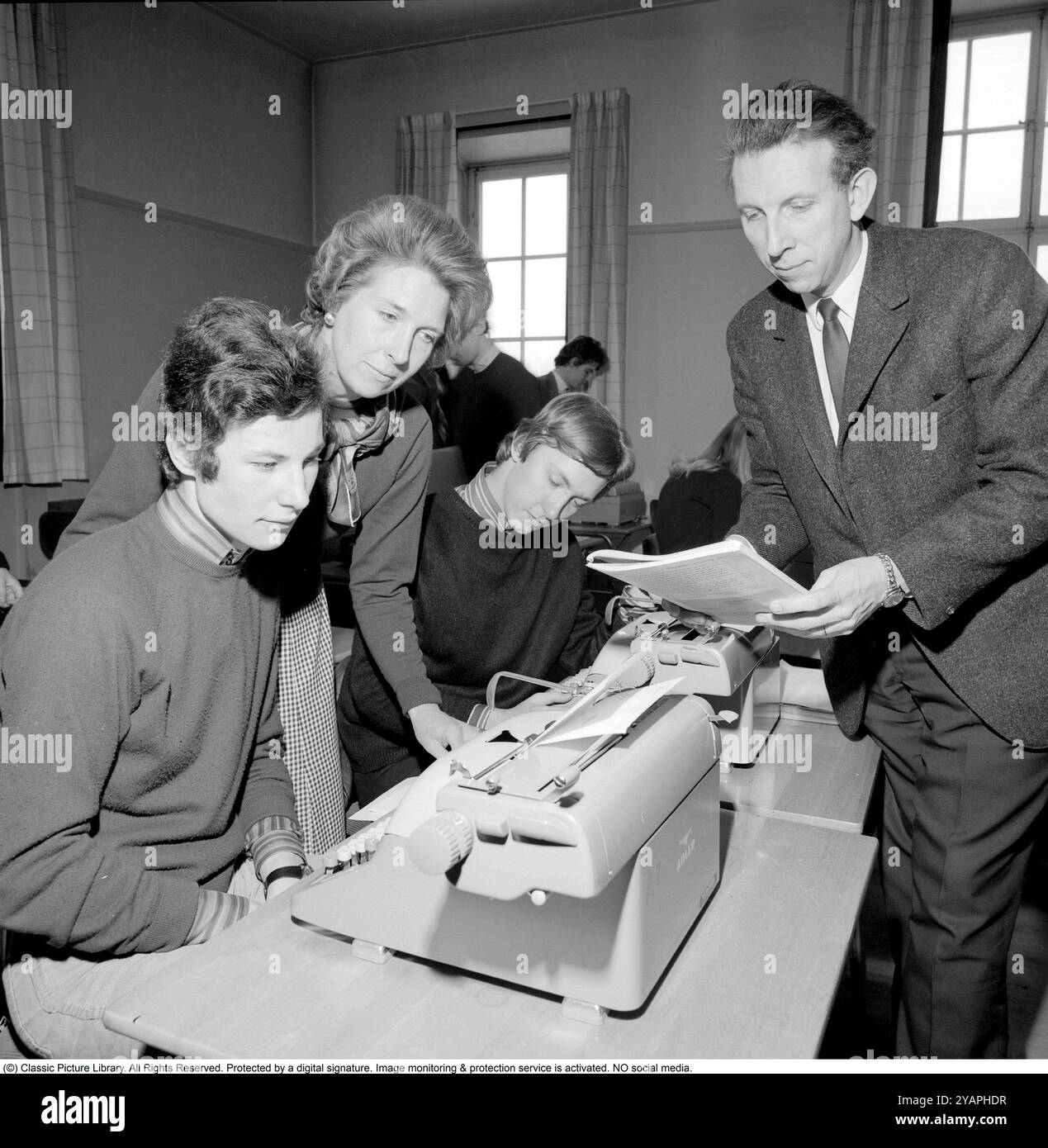 Learning to type in the 1960s. A classroom of students sitting at ...