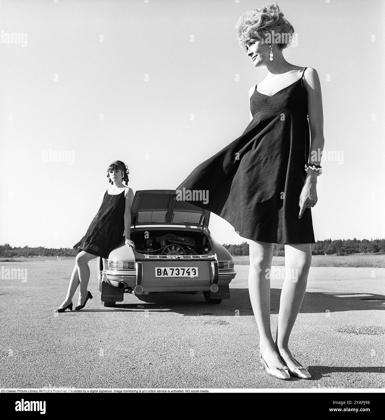 Porsche June 1967. Two fashion models dressed in the fashion of the ...