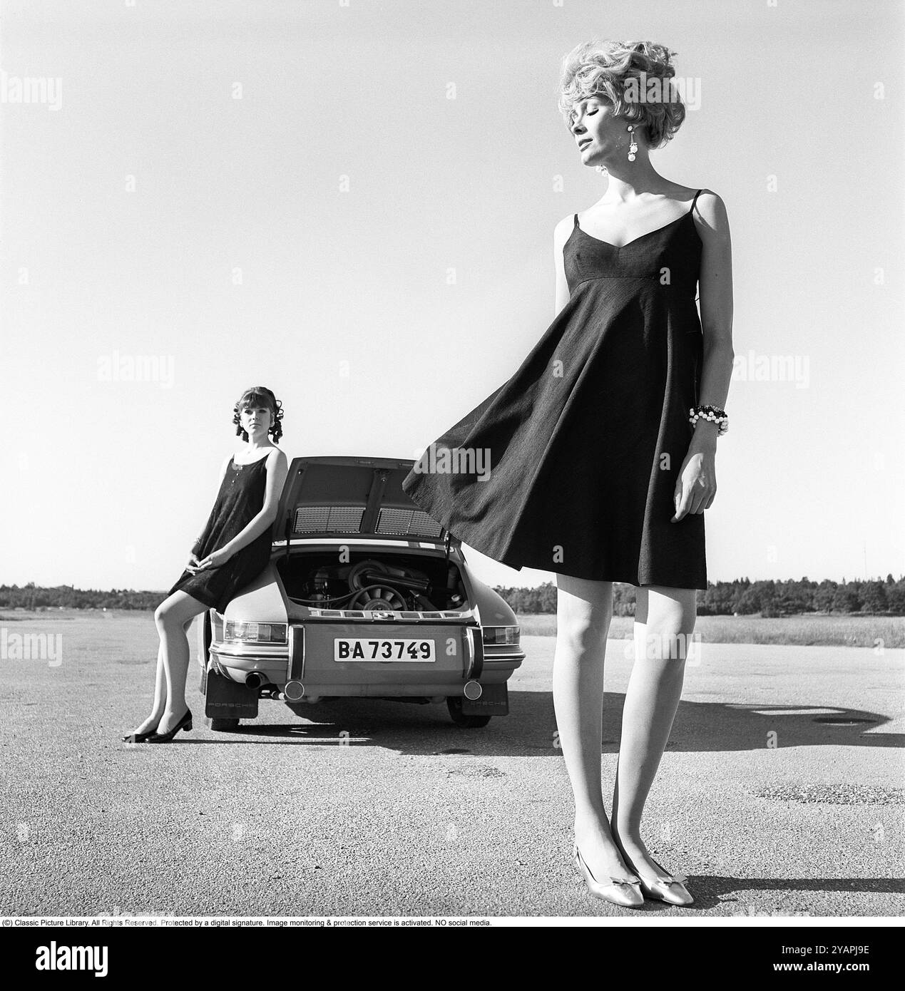 Porsche June 1967. Two fashion models dressed in the fashion of the ...