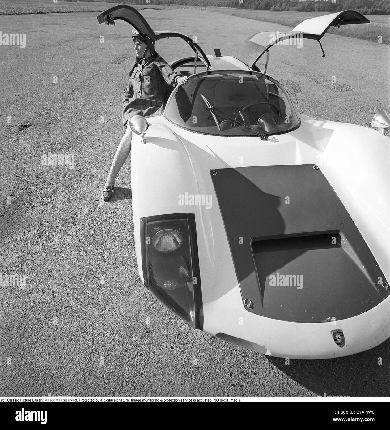 Porsche June 1967. A model dressed in the fashion of the year at a ...