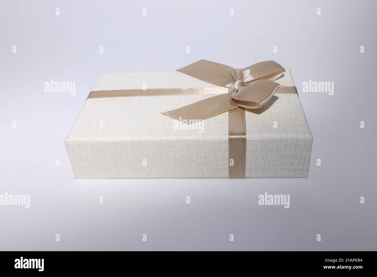Beige gift box, with a brown bow, isolated on a white background Stock ...