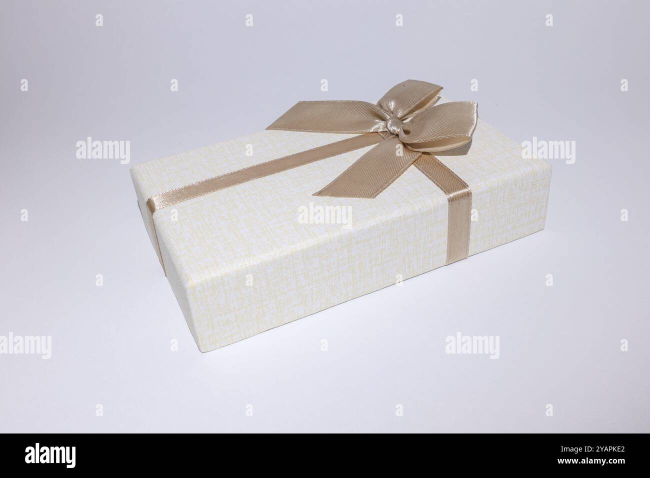 Beige gift box, with a brown bow, isolated on a white background Stock ...