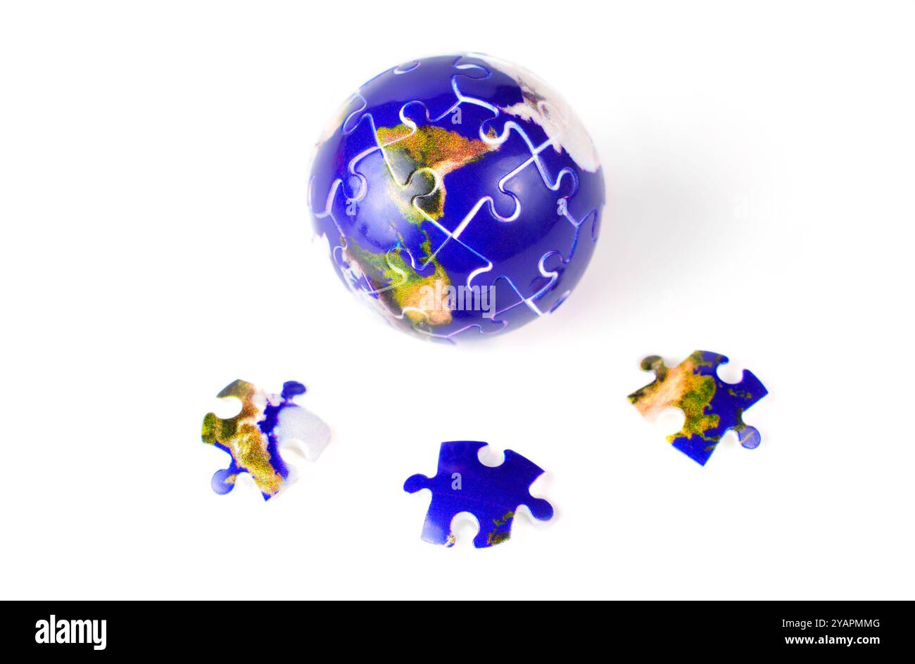 Globe designed as a 3D puzzle with several missing pieces on a bright ...