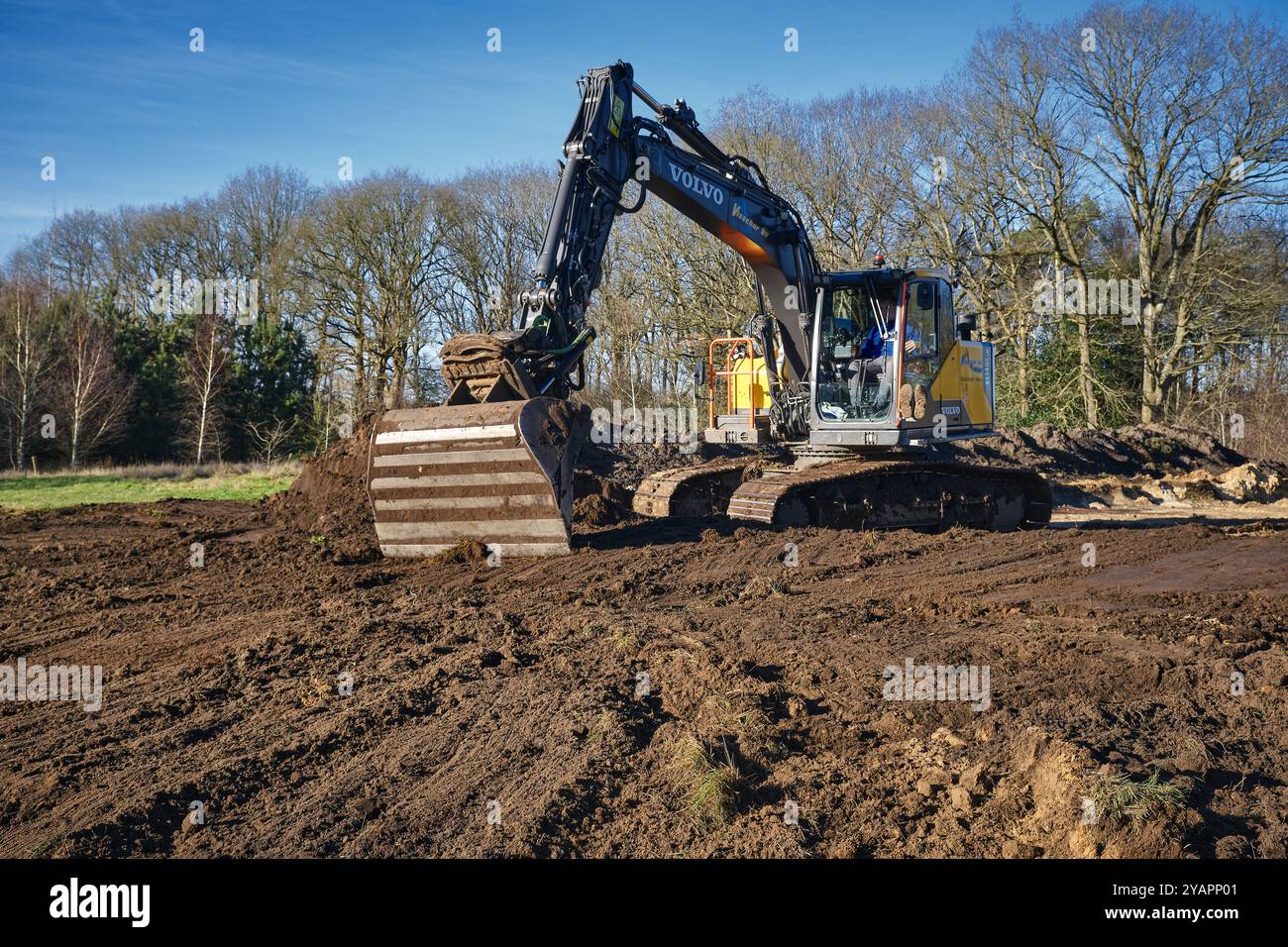 A heavy hydraulic machine doing work to bring the upper soil in place ...